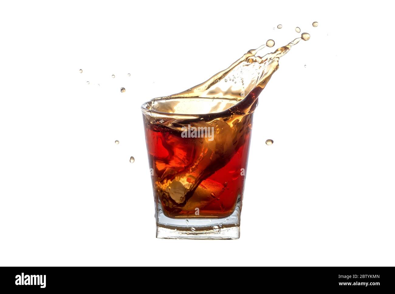 Splash pop soda in glass close-up isolated on a white background ...