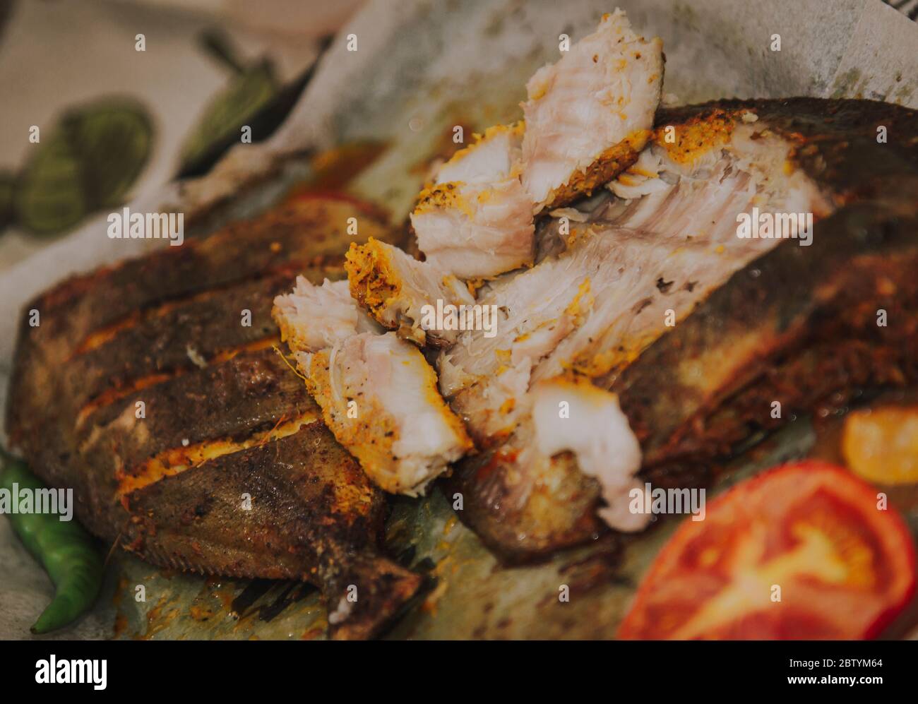 Black Pomfret grilled Stock Photo - Alamy