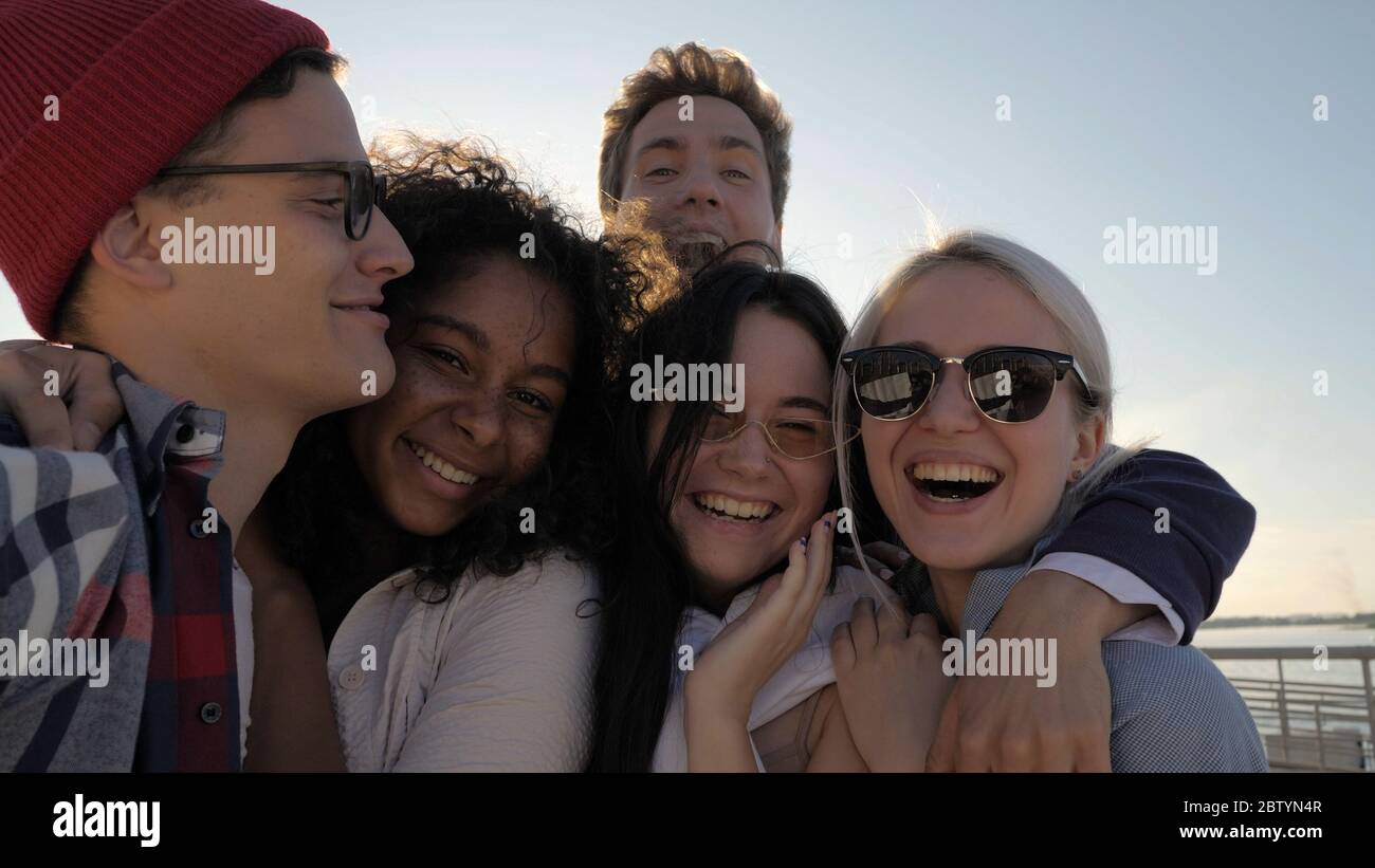Smiling students taking selfie in the summer sun Stock Photo - Alamy