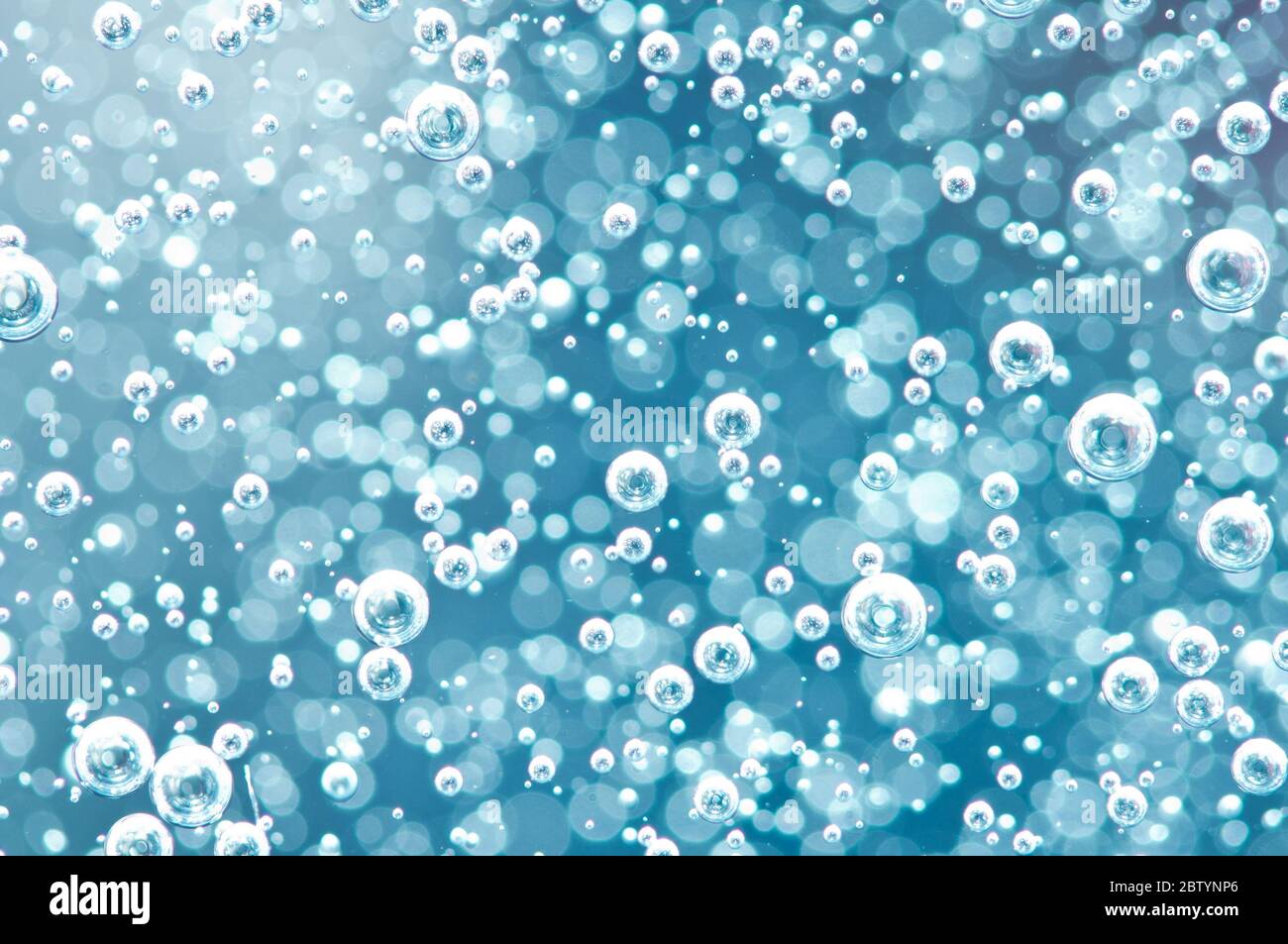 Macro Oxygen bubbles in water on blured background, concept such as ...