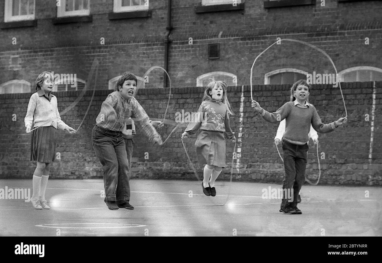 Children skipping in playground Black and White Stock Photos & Images ...