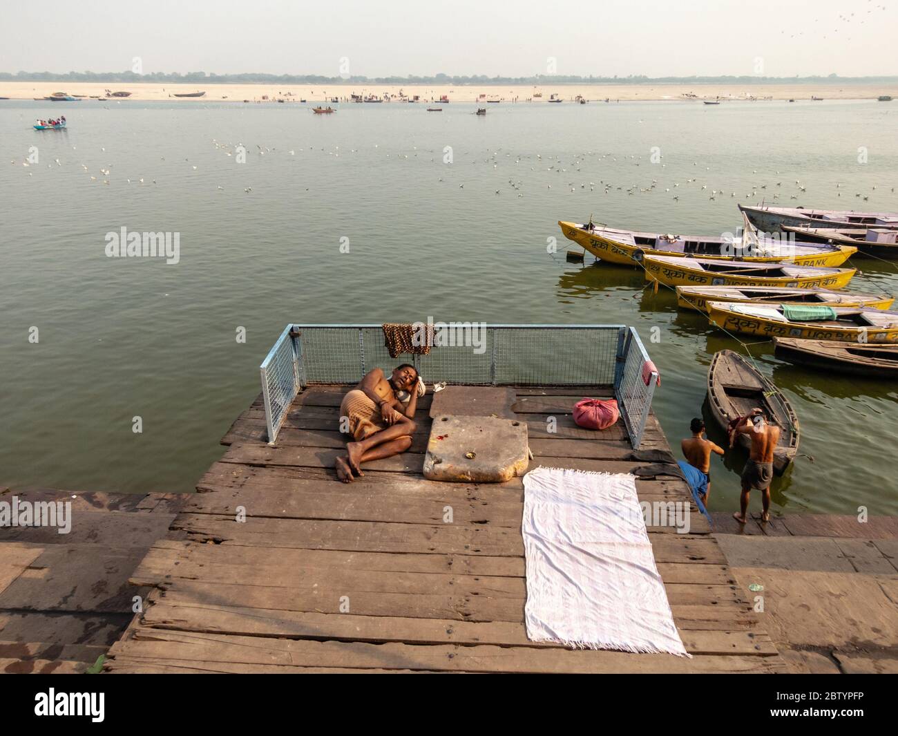 Old man on boat varanasi ghats hi-res stock photography and images - Alamy