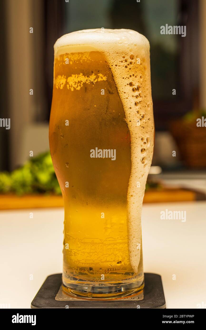 beer on bar table on blur background Stock Photo - Alamy
