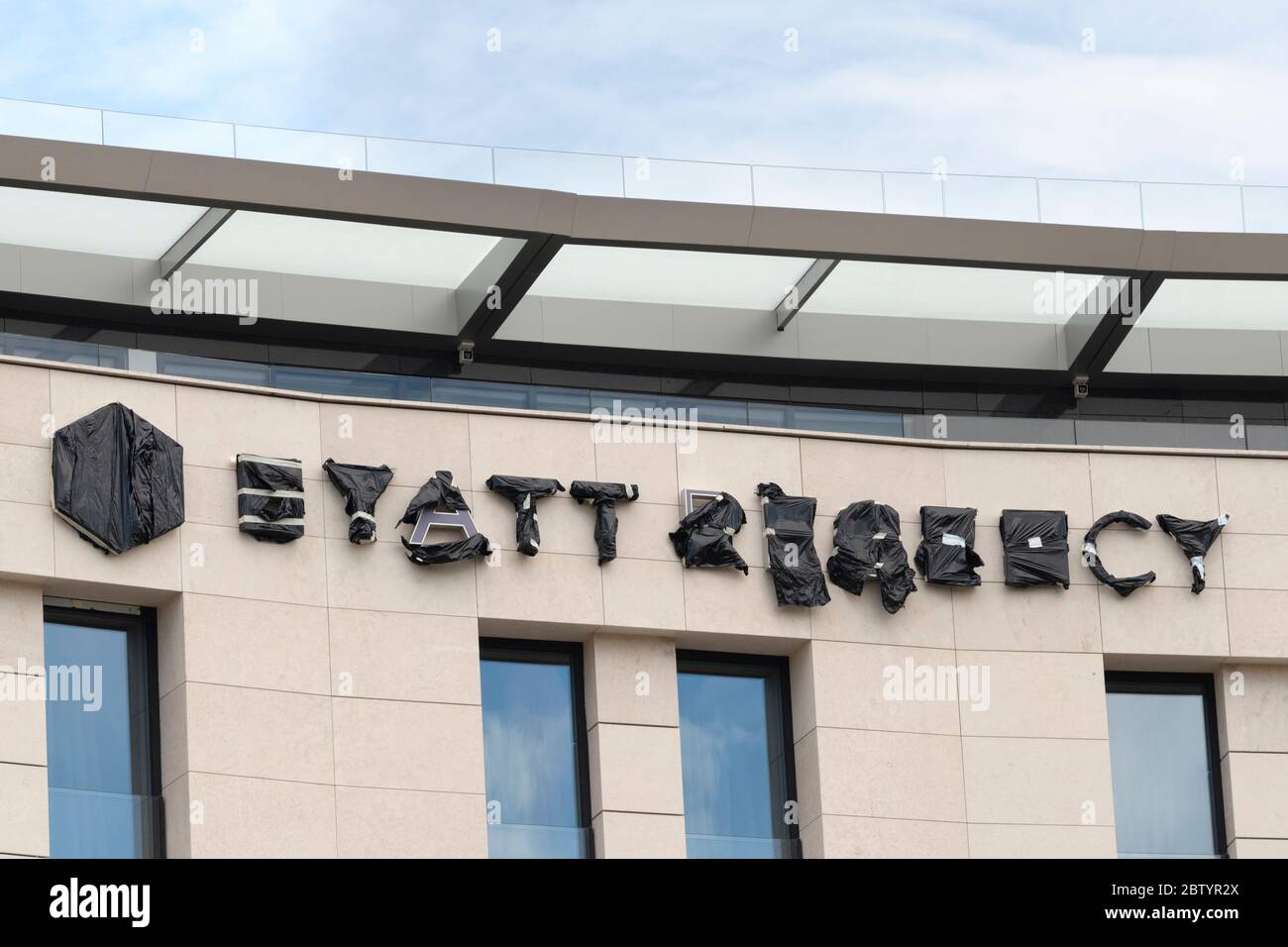 Hyatt Regency badge sign board and logo on hotel facade wrapped in ...
