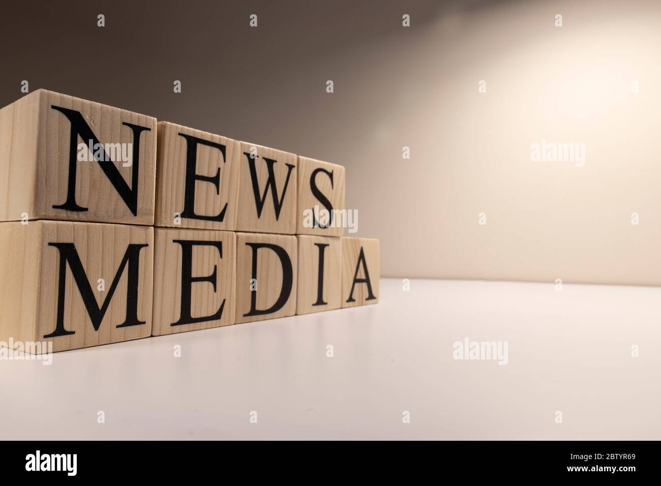 News and media text from wooden cubes. On a white background Stock ...