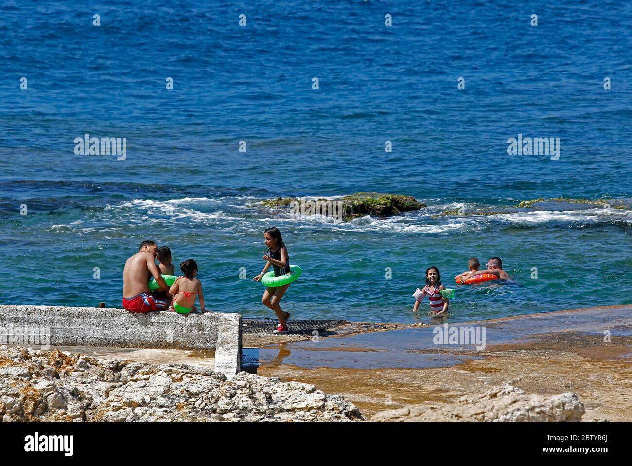 Beirut, Lebanon. 28th May, 2020. People enjoy swimming at the seaside ...