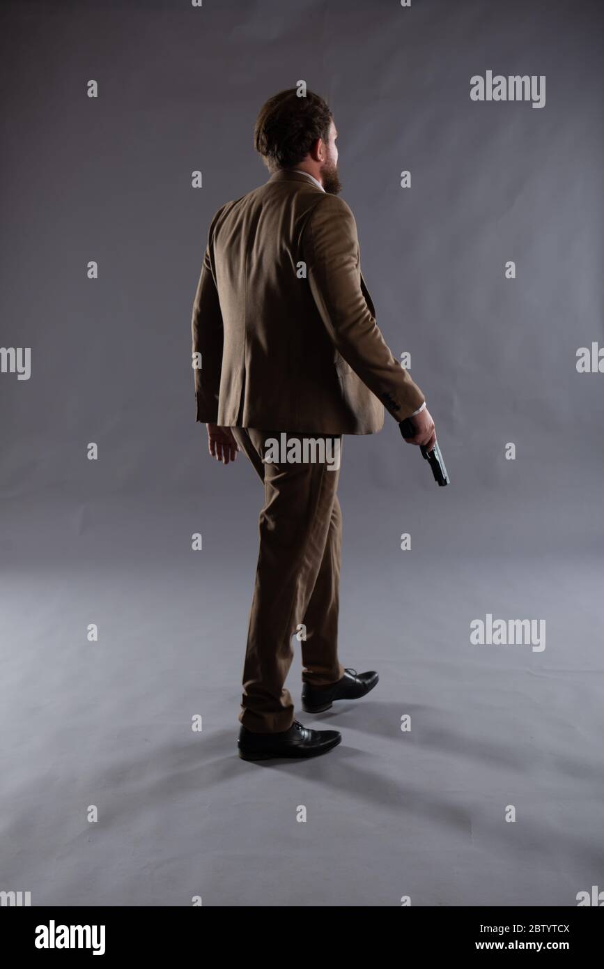 Detective man walking away hi-res stock photography and images - Alamy