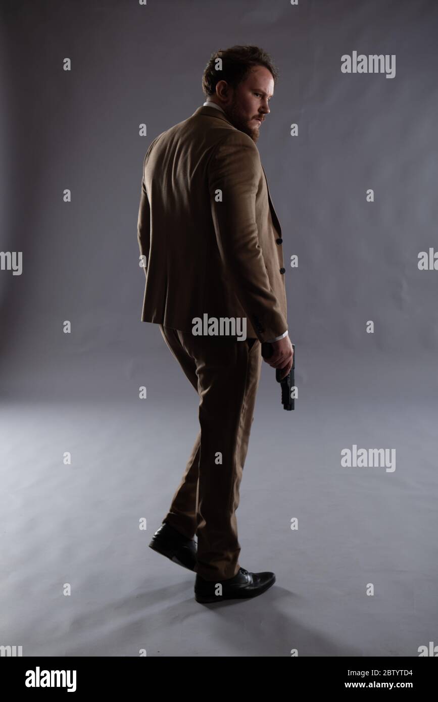 Detective man walking away hi-res stock photography and images - Alamy