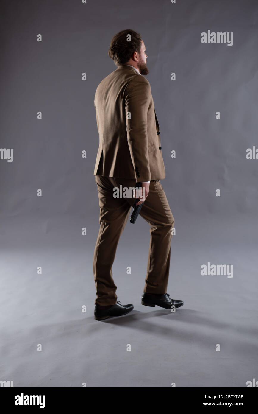 Detective man walking away hi-res stock photography and images - Alamy
