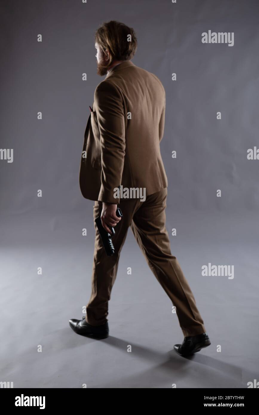 Detective man walking away hi-res stock photography and images - Alamy