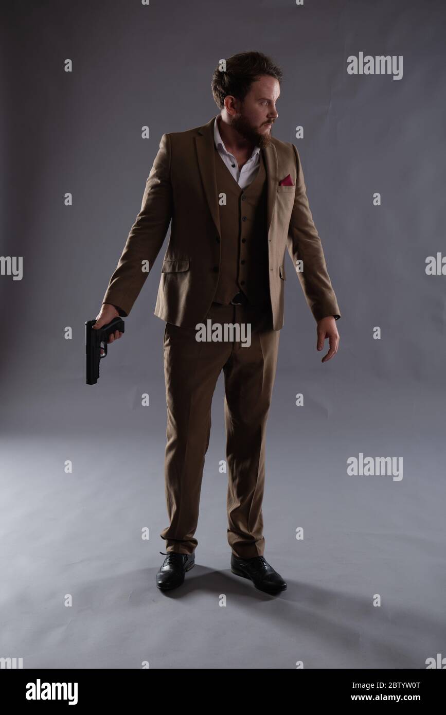 Man holding gun hi-res stock photography and images - Alamy