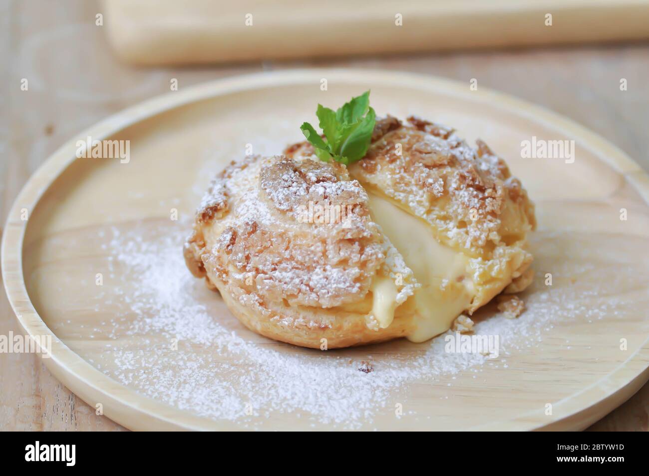 choux cream or cream puff, eclair in the wooden dish Stock Photo - Alamy