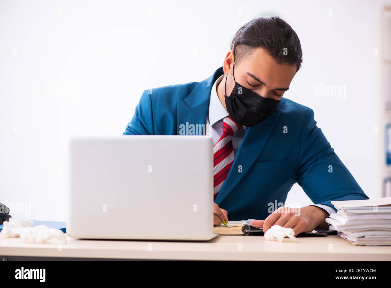 Sick employee suffering at workplace from covid-19 Stock Photo - Alamy
