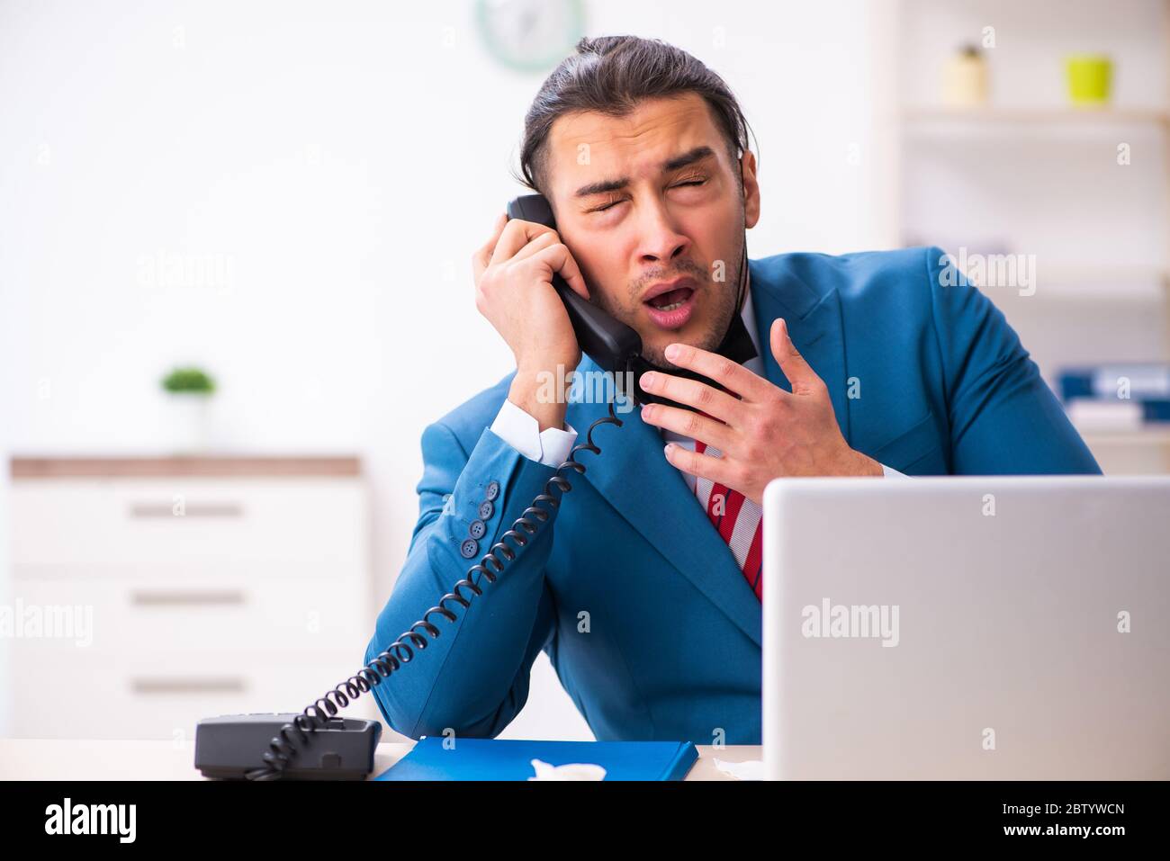 Sick employee suffering at workplace from covid-19 Stock Photo - Alamy