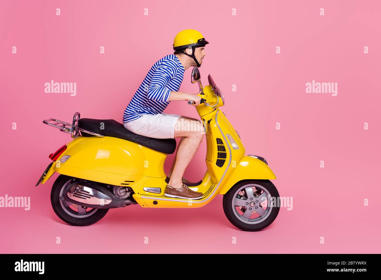 Profile side view of his he nice attractive handsome focused guy riding ...