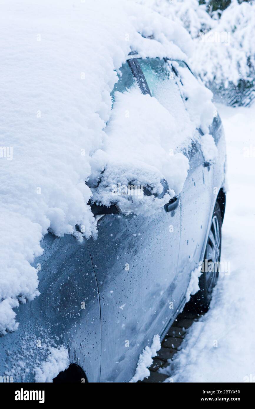 Snow-covered car in side view with tire tread and rim in Lower Bavaria ...