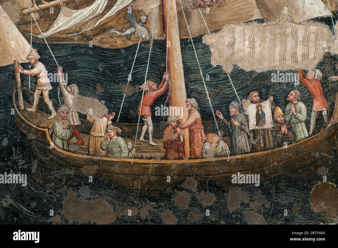 Passengers pray on a ship in stormy seas as winged demons circle the ...