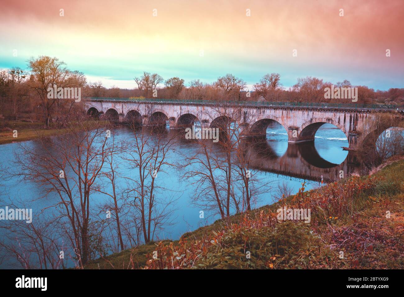 Digoin canal bridge. Boat canal bridge over Laura river in early spring ...