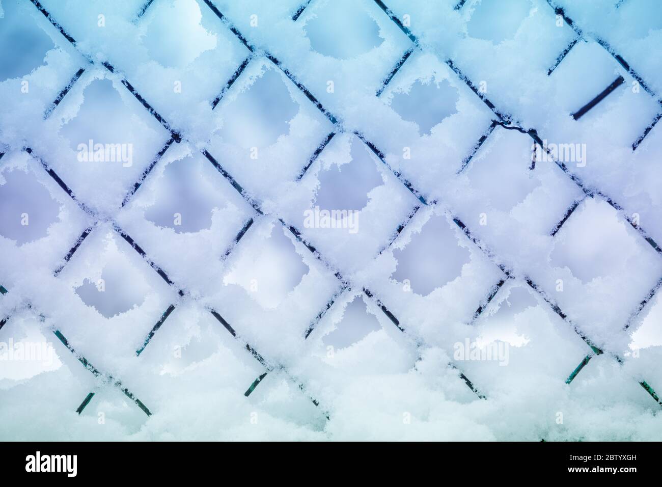 Abstract winter background. Snow on the metal grid Stock Photo - Alamy