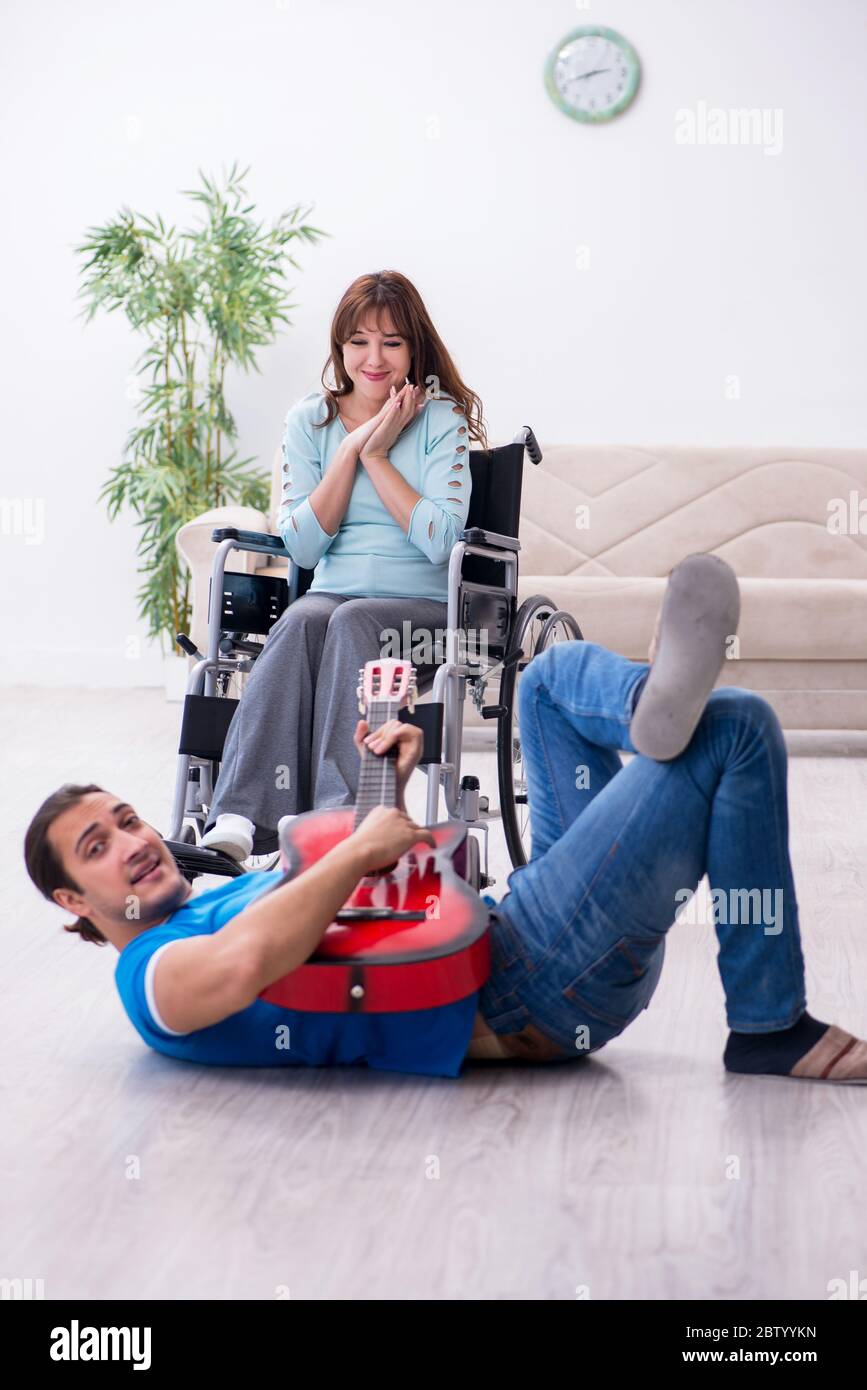Disabled wife and husband at home Stock Photo - Alamy
