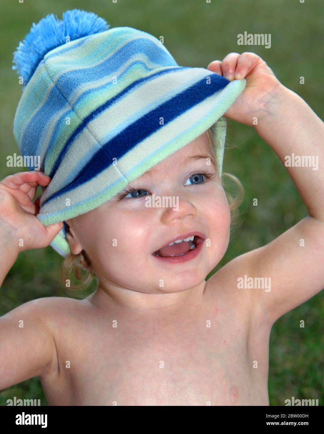 Baby girl smiling striped hi-res stock photography and images - Alamy