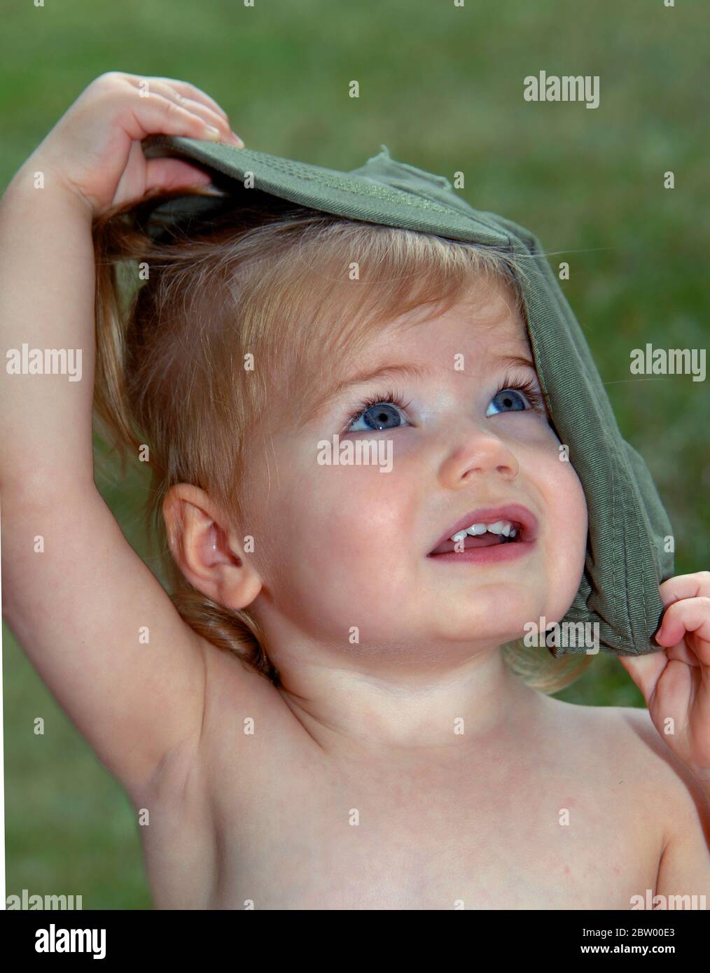 Little girl wants to follow in her father's shoes by wearing his green ...