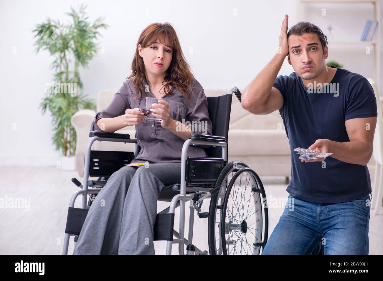 Disabled wife and husband at home Stock Photo - Alamy