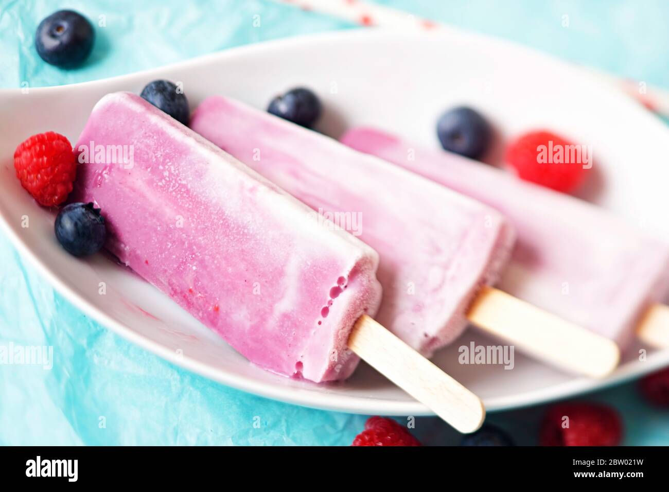 Marble blueberry and raspberry ice cream popsicles Stock Photo - Alamy