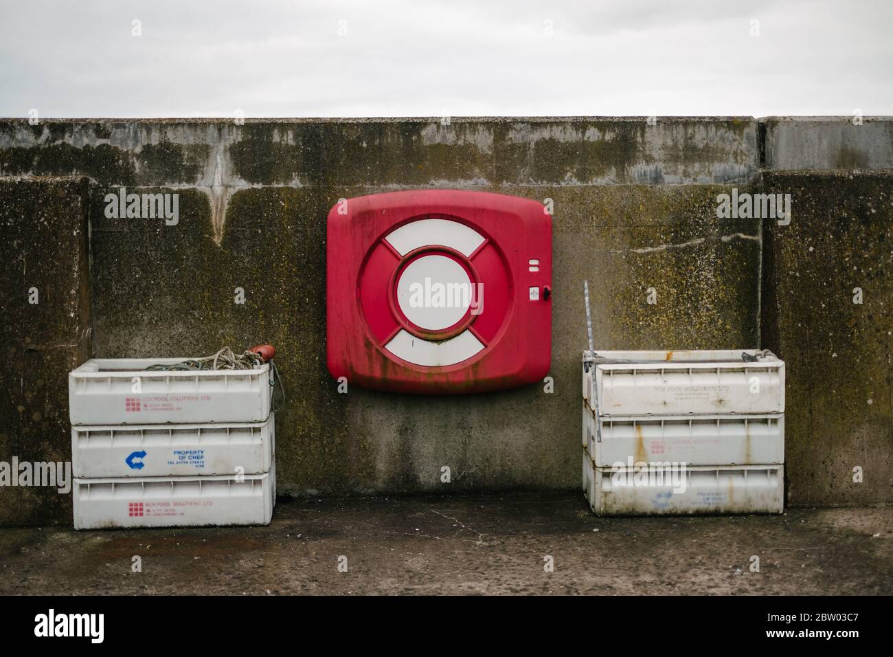 A life preserver, or lifebelt as it is more commonly know, flanked by ...
