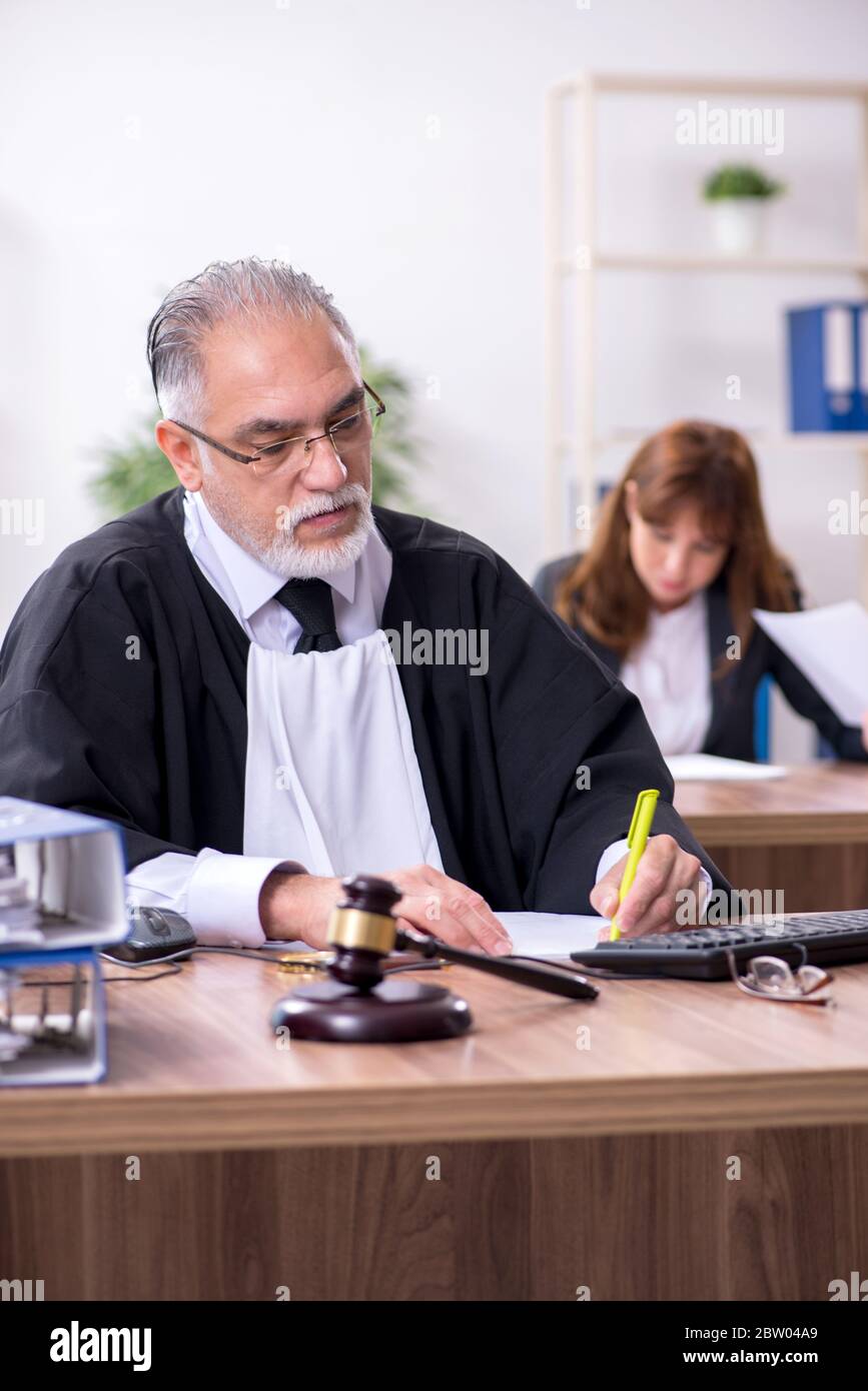 Old judge and his young secretary in the office Stock Photo - Alamy
