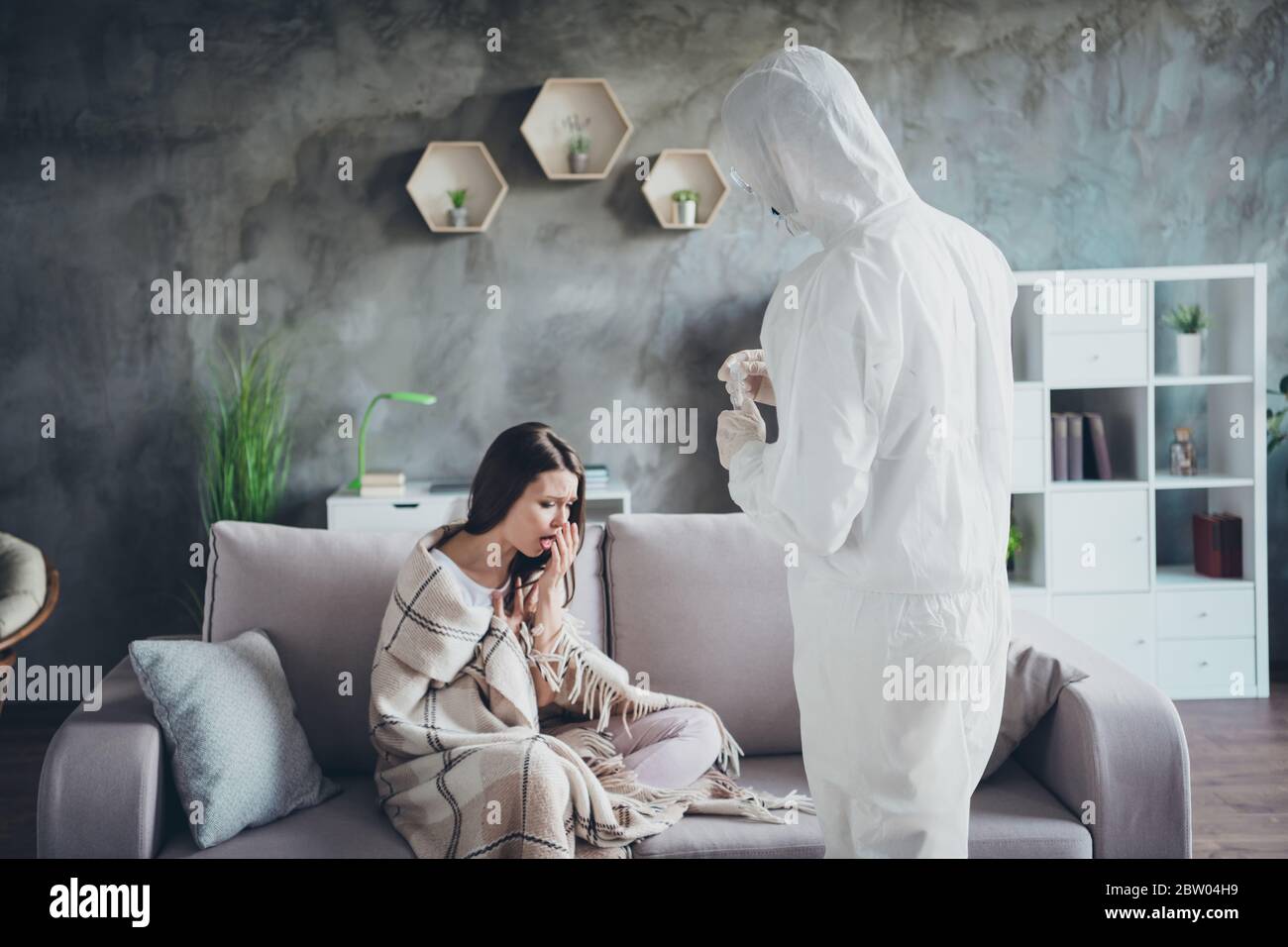 Photo of young sick patient lady sit sofa unwell call ambulance guy doc ...