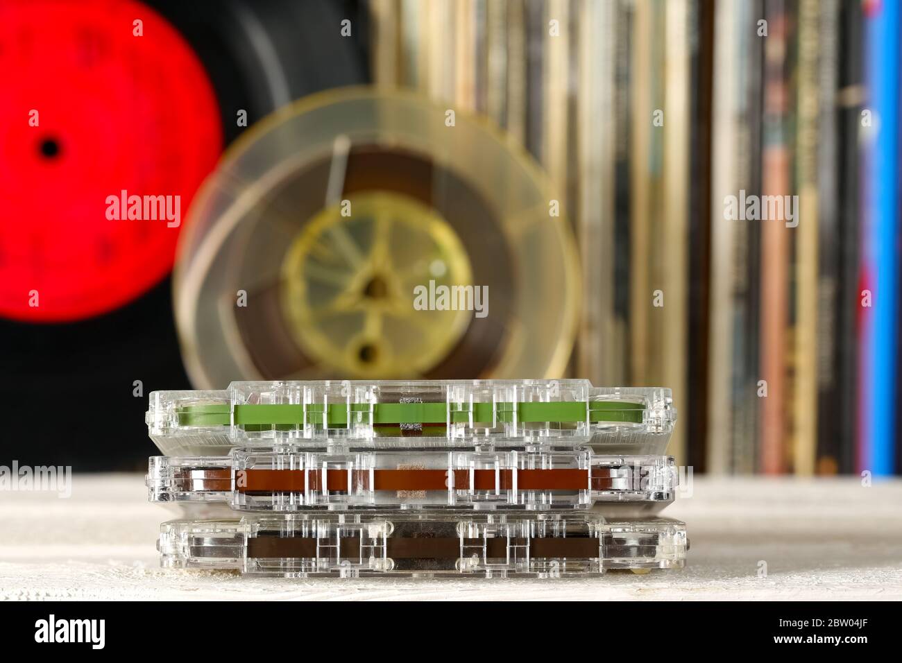 Compact cassettes and reel tape and vinyl records Stock Photo - Alamy
