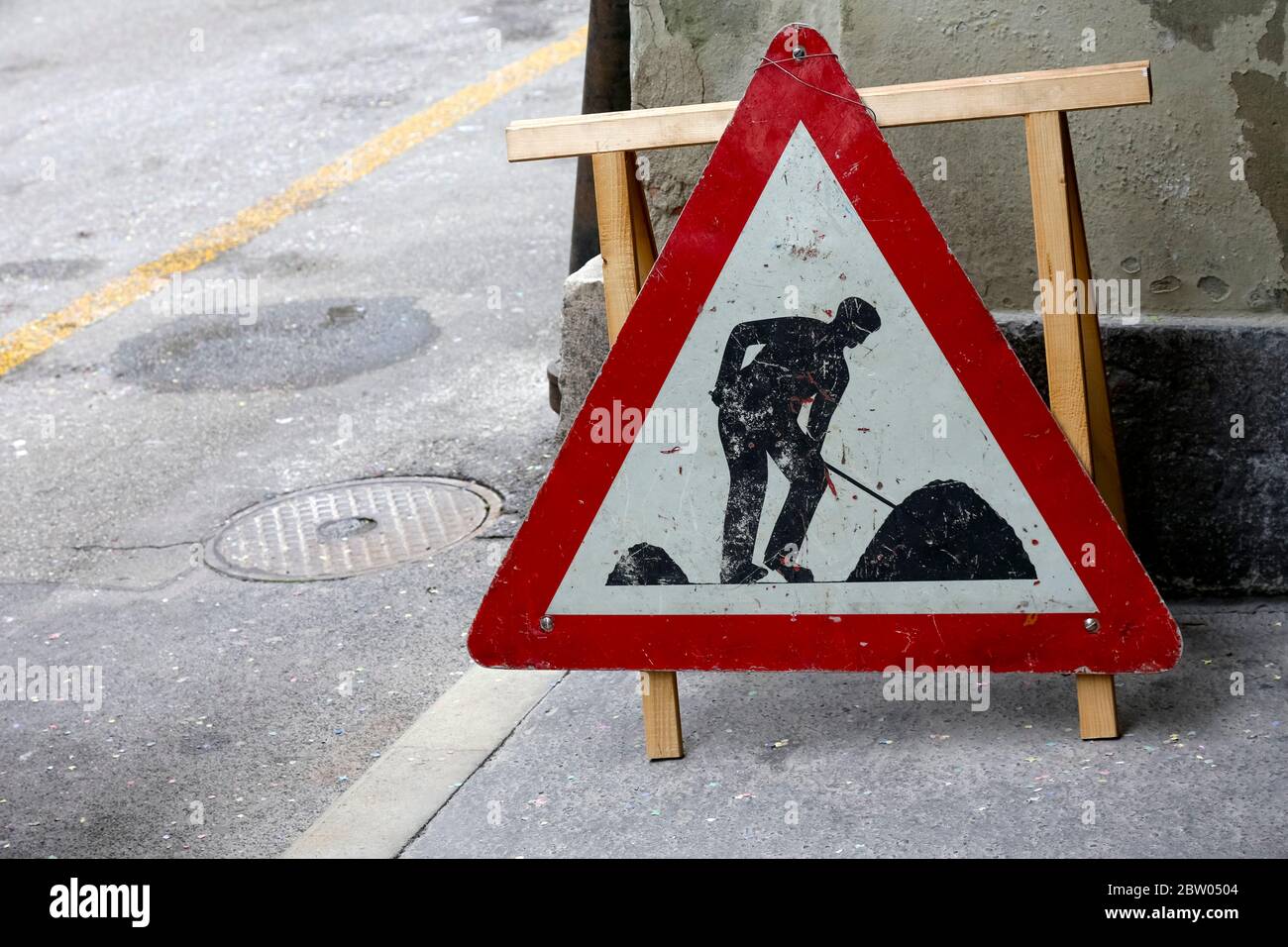Road works sign is placed somewhere next to the street and it is ...