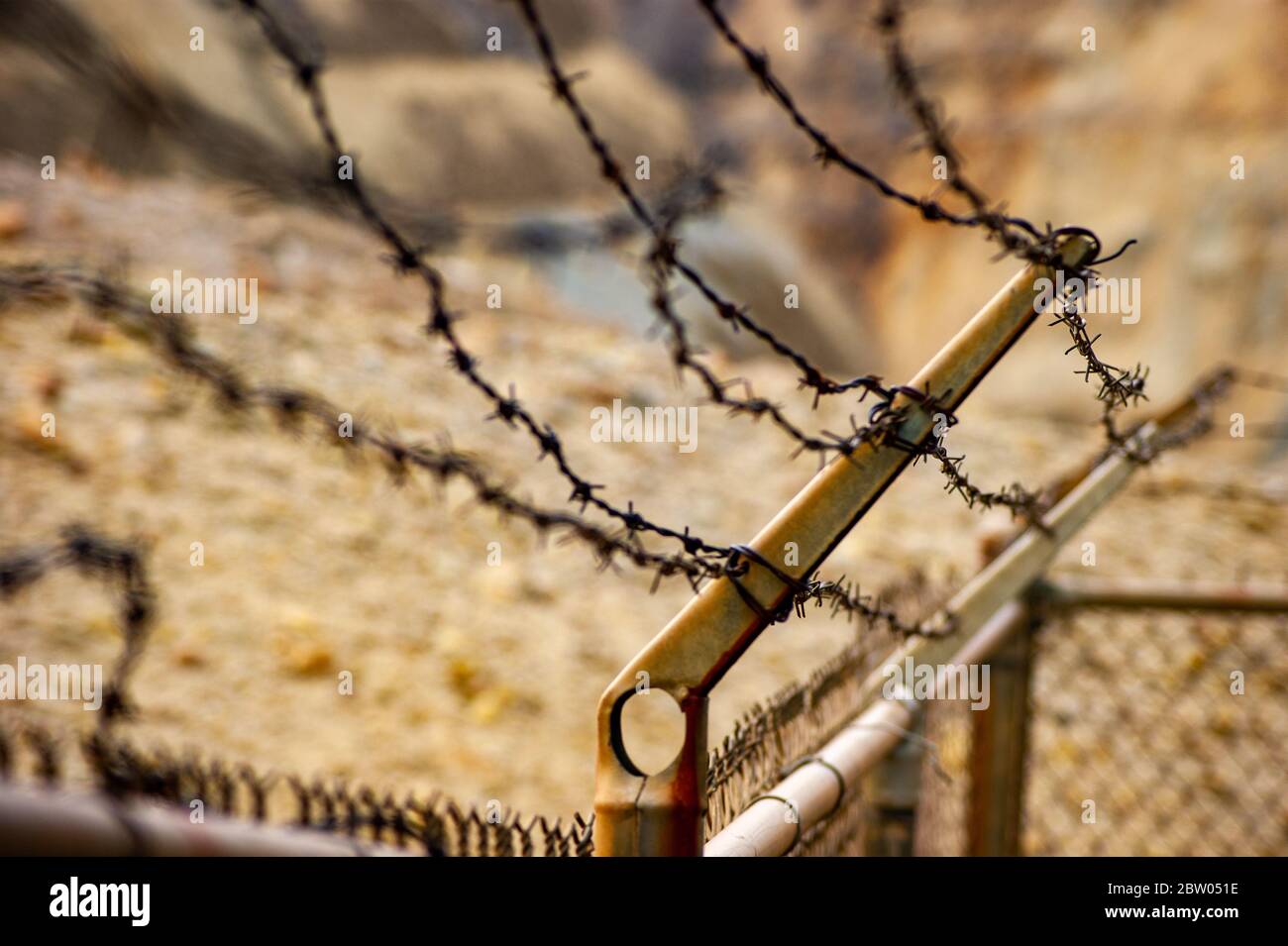 Barbed Wire Protection Fence Stock Photo - Alamy
