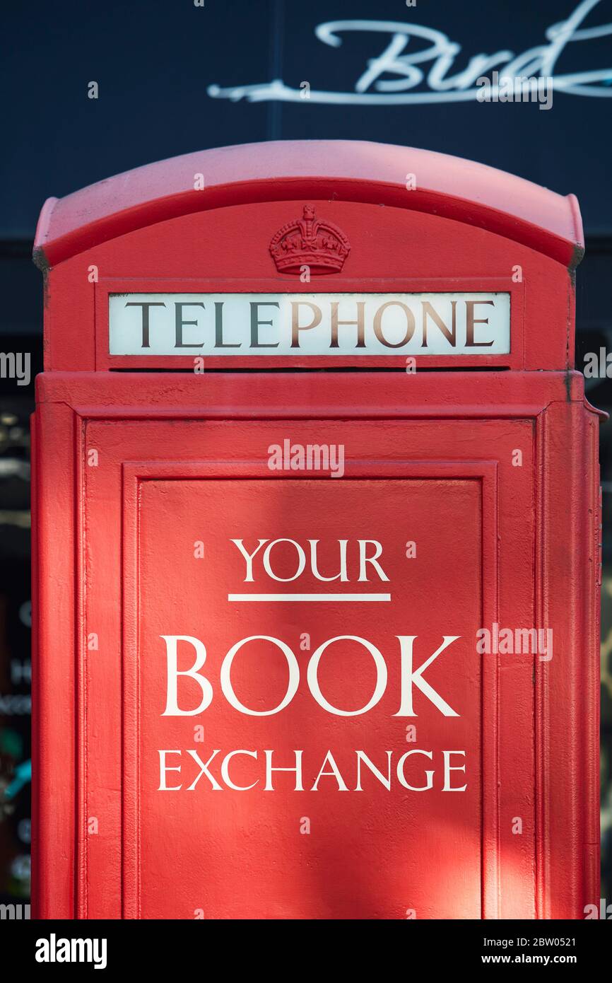Traditional red telephone box converted into a book exchange in the ...