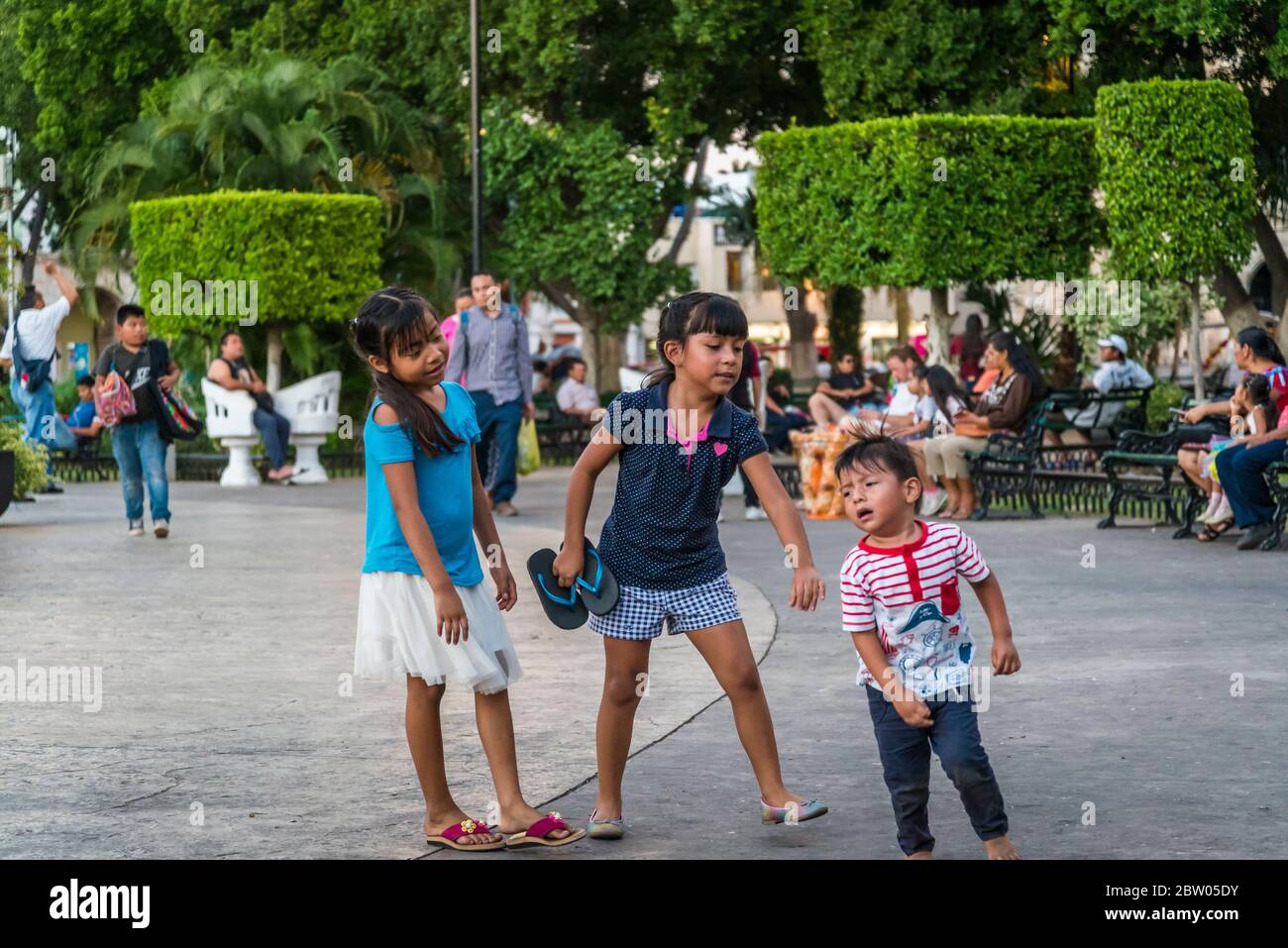 Maya children playing at the Plaza Grande, Merida, Yucatan, Mexico ...