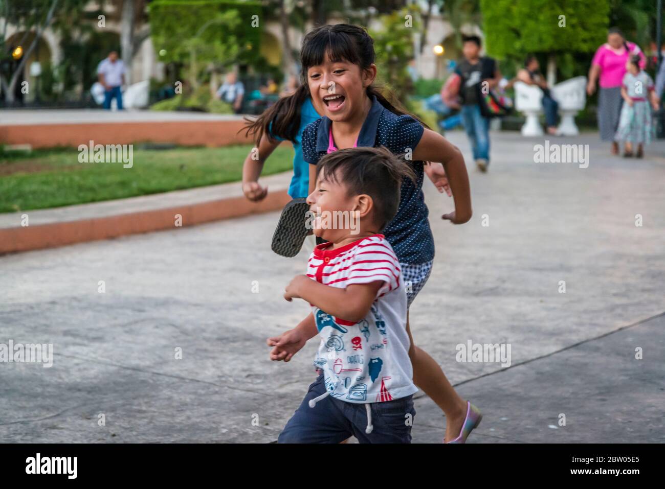 Maya children playing at the Plaza Grande, Merida, Yucatan, Mexico ...