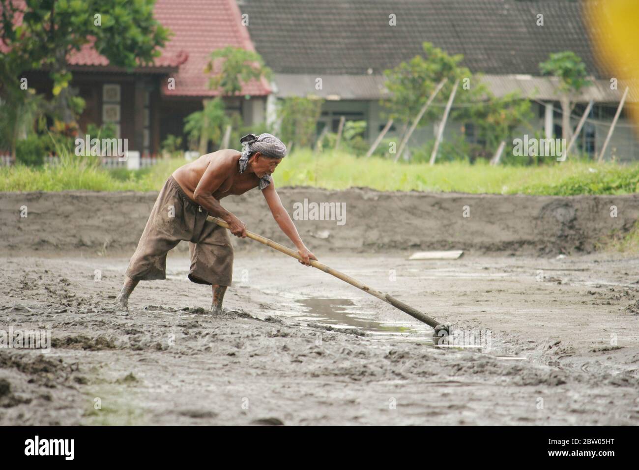 Man hoeing hi-res stock photography and images - Alamy