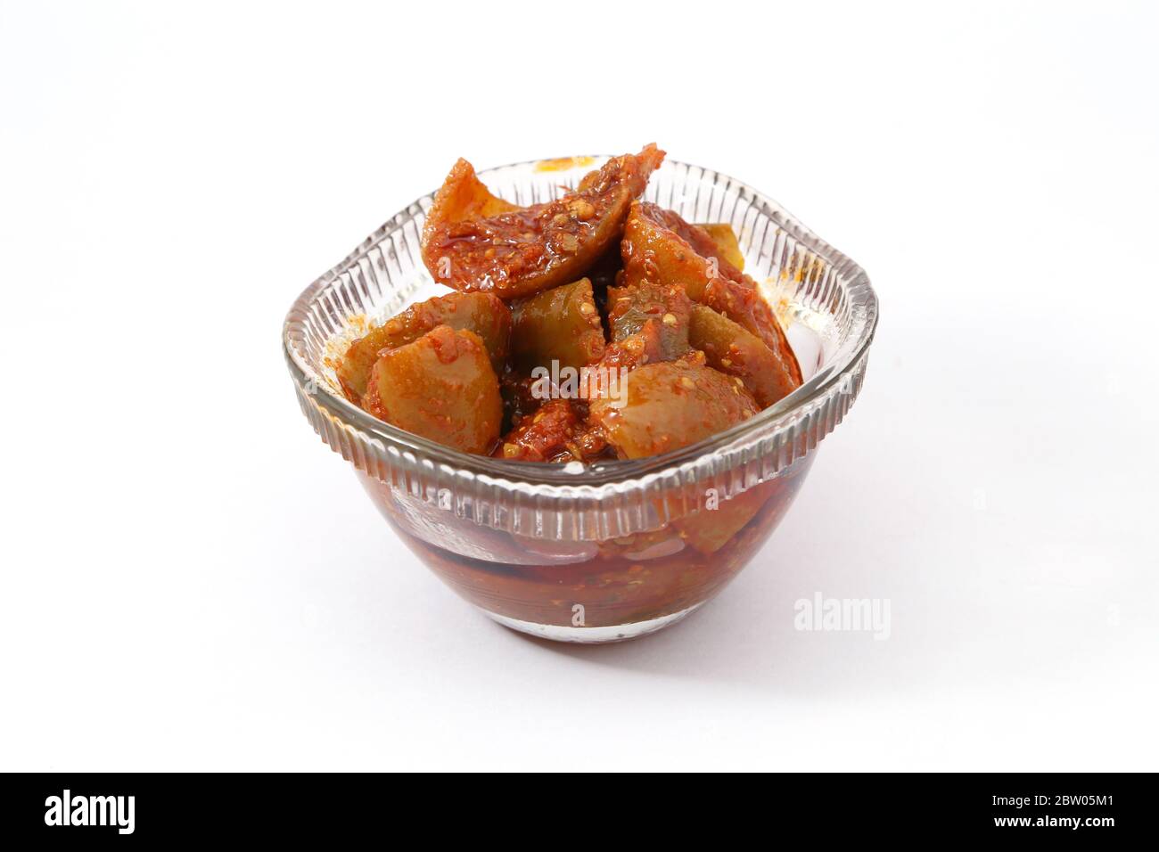 Indian style pickle in a glass bowl on white background Stock Photo - Alamy