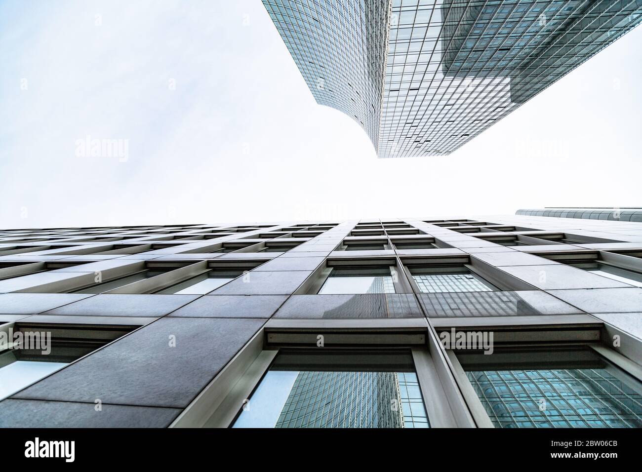 view of vertically rising walls of two skyscrapers Stock Photo - Alamy