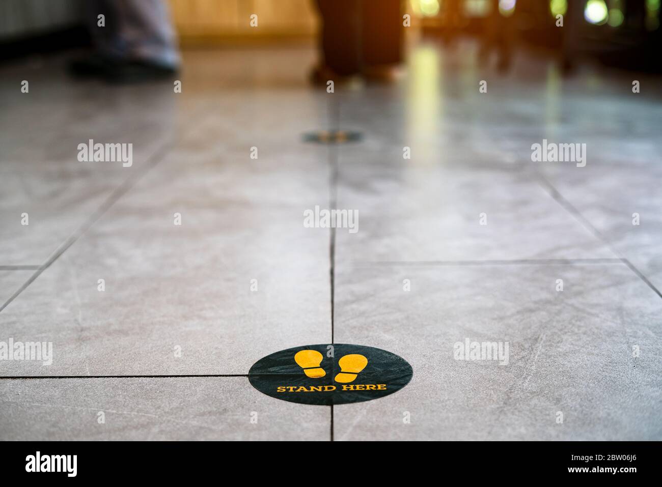 Stand here foot sign or symbol on the floor in coffee shop Stock Photo ...