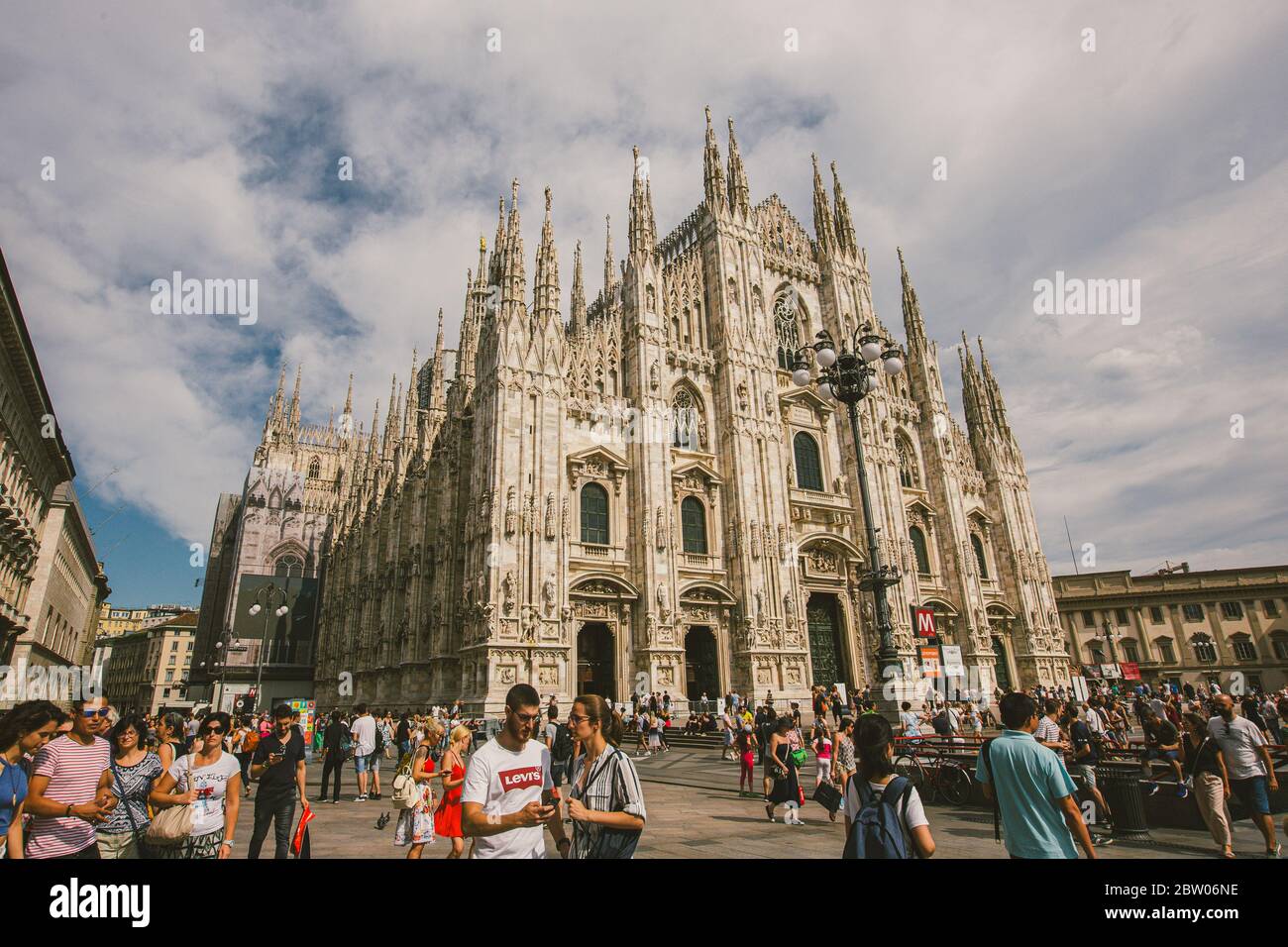 Duomo square crowded by people in sunny day Italy, Milan July 15, 2017 ...