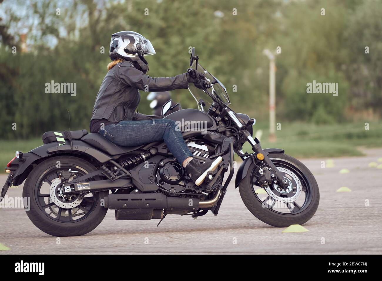 Bikers driving a motorcycle rides along the asphalt road Stock Photo ...