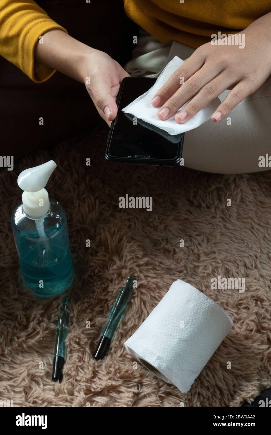Cleaning smartphone display from dust hi-res stock photography and ...