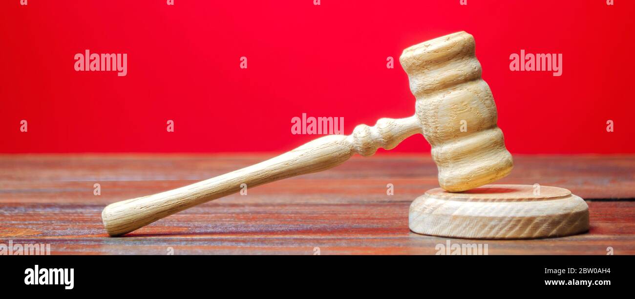 Judge's hammer on a red background. The judicial system. Norms, rules ...