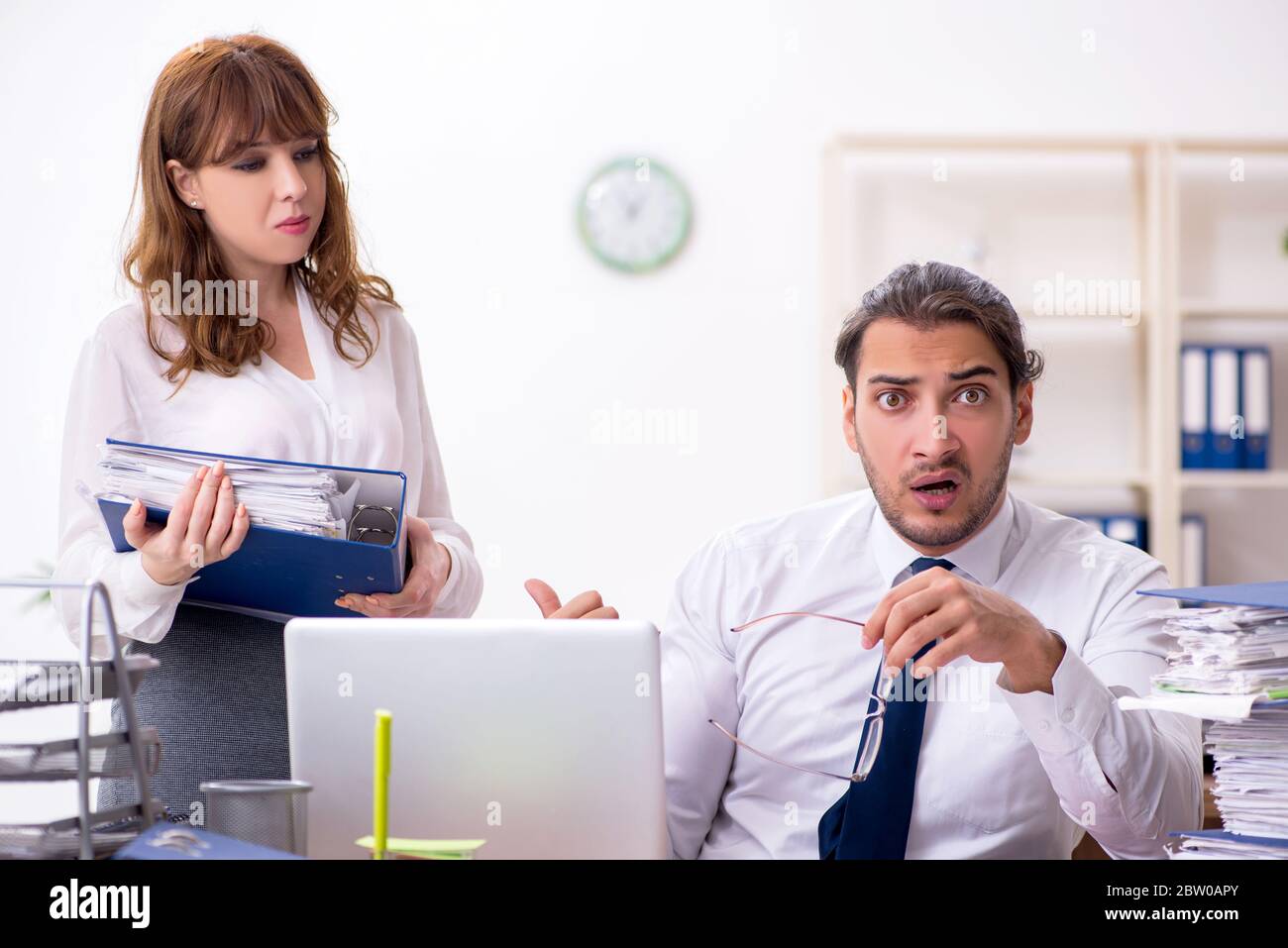 Two employees working in the office environment Stock Photo - Alamy