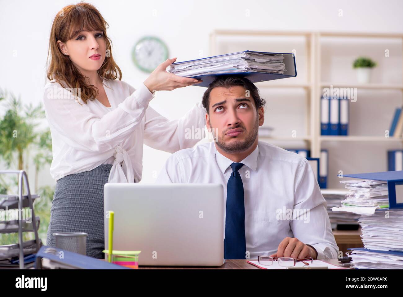 Two employees working in the office environment Stock Photo - Alamy