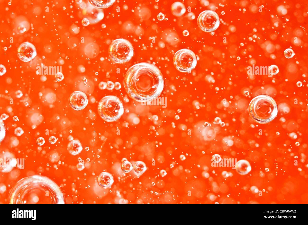 Macro bubbles of oxygen in the blood. Red-orange liquid Stock Photo - Alamy