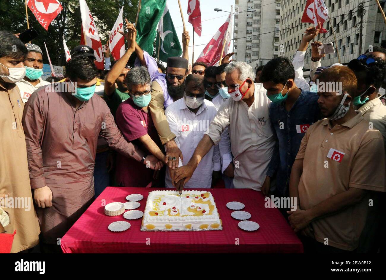 Activists of Pasban Pakistan are cutting cake during celebration ...