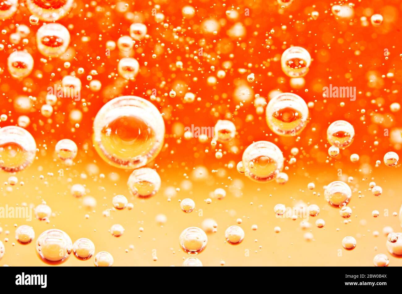 Macro bubbles of oxygen in the blood. Red-orange liquid Stock Photo - Alamy